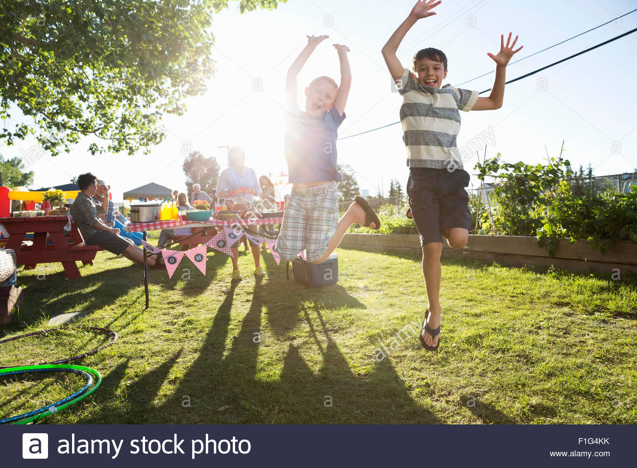 Boys jumping into hi-res stock photography and images - Alamy