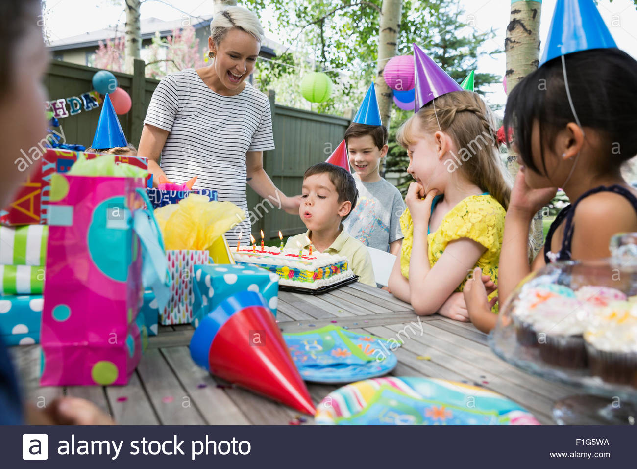 Adult blowing out candles hi-res stock photography and images - Alamy