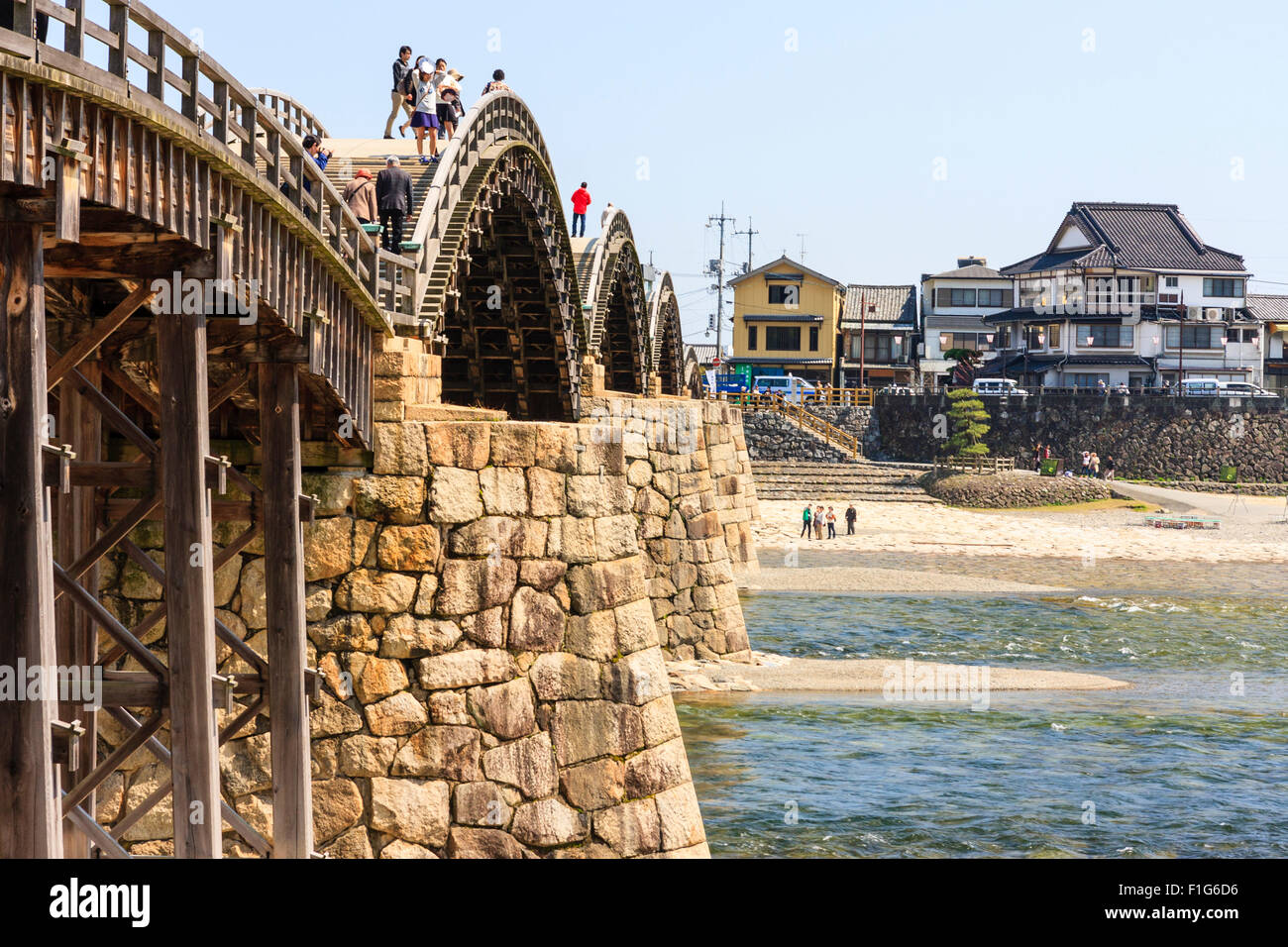 Iwakuni, Japan. The multi-arched wooden Kintaikyo bridge, with people ...