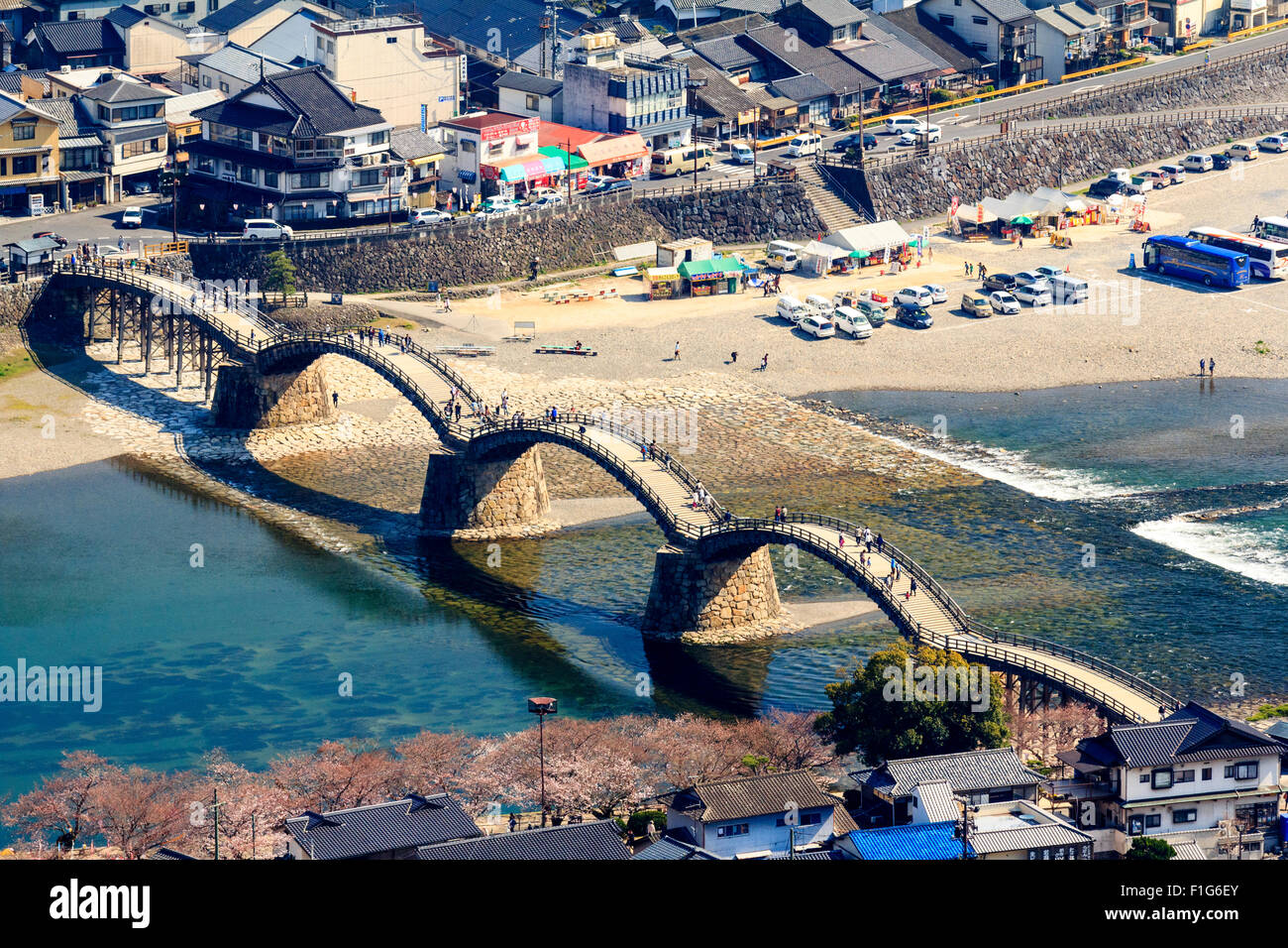 Iwakuni, Japan. The multi-arched wooden Kintaikyo bridge, with people ...