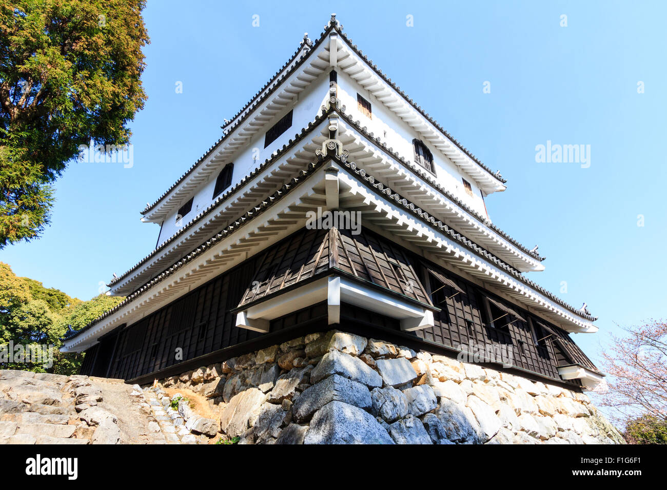 Iwakuni castle in Japan. Corner view of castle keep, looking up with ...