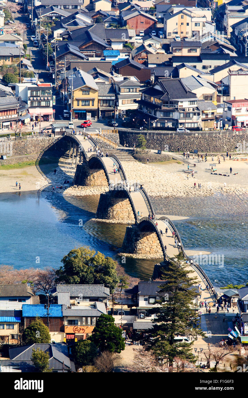 Iwakuni, Japan. The multi-arched wooden Kintaikyo bridge, with people ...