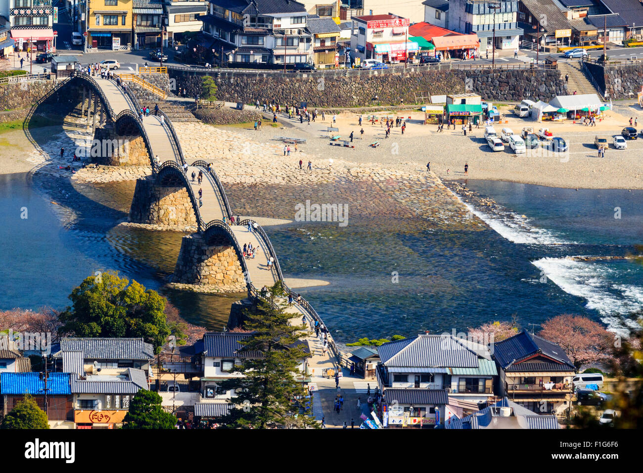 Iwakuni, Japan. The multi-arched wooden Kintaikyo bridge, with people ...