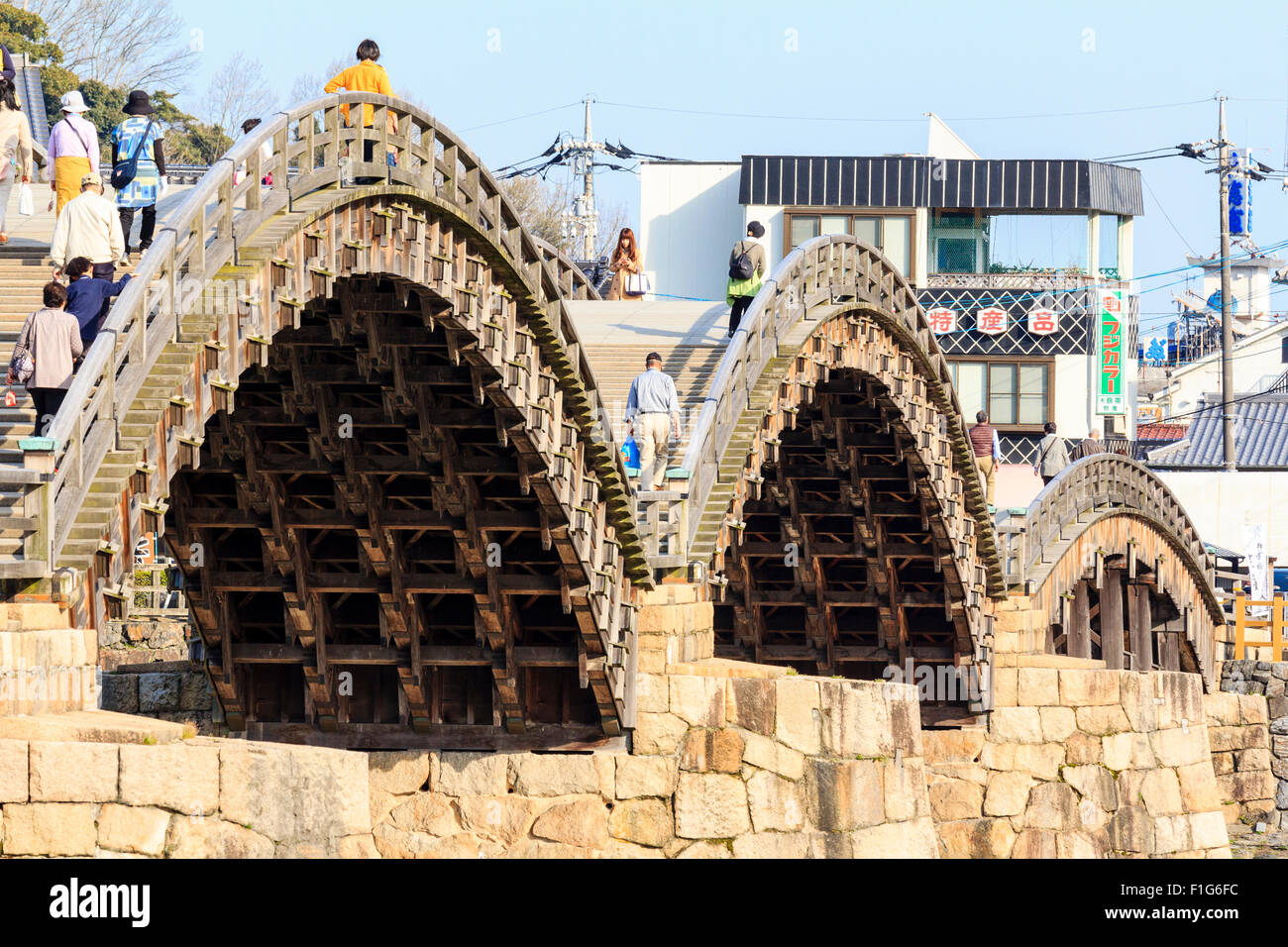 Iwakuni, Japan. The multi-arched wooden Kintaikyo bridge, with people ...