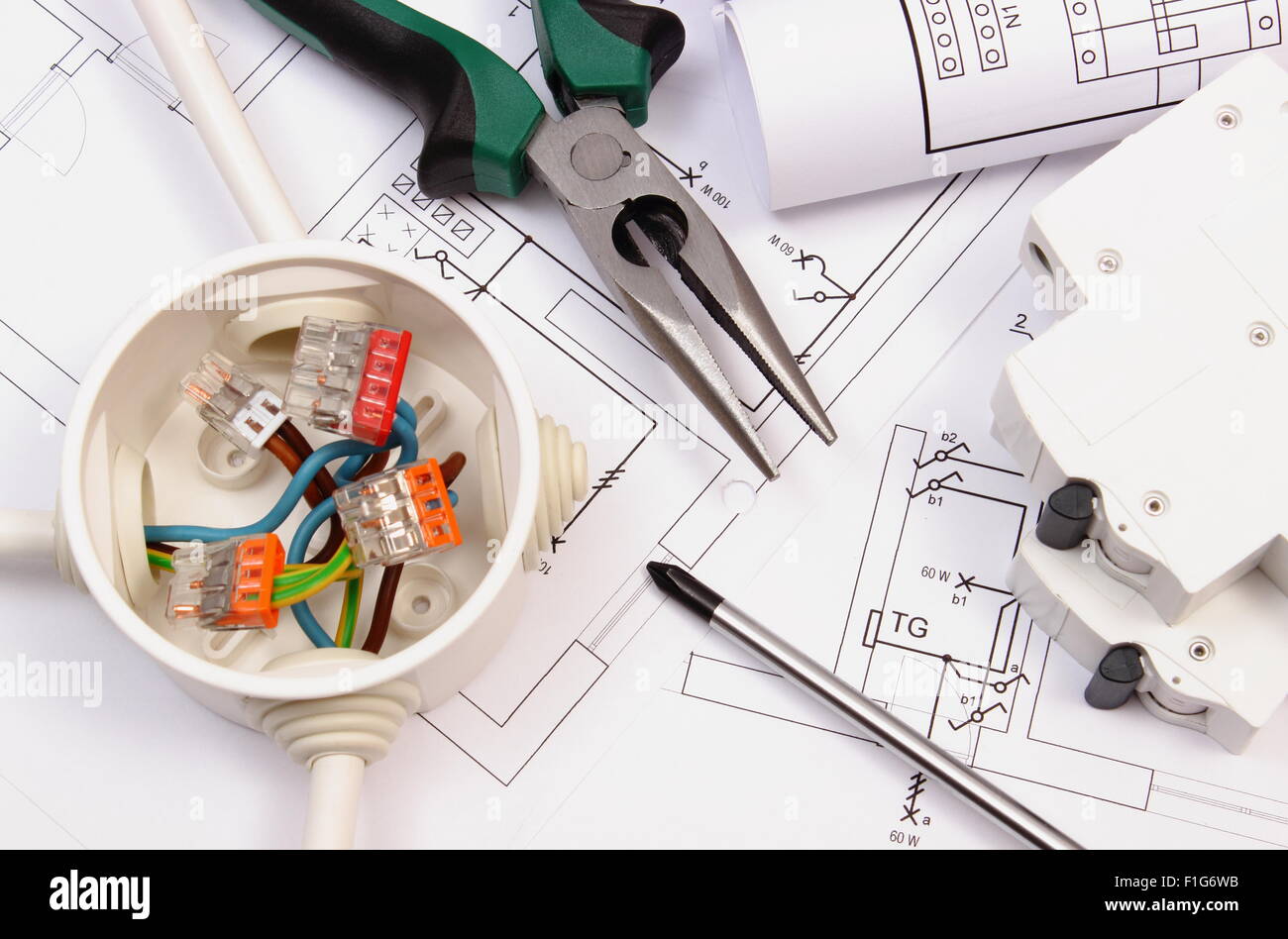 Work tools, cable in electrical box and electric fuse lying on ...