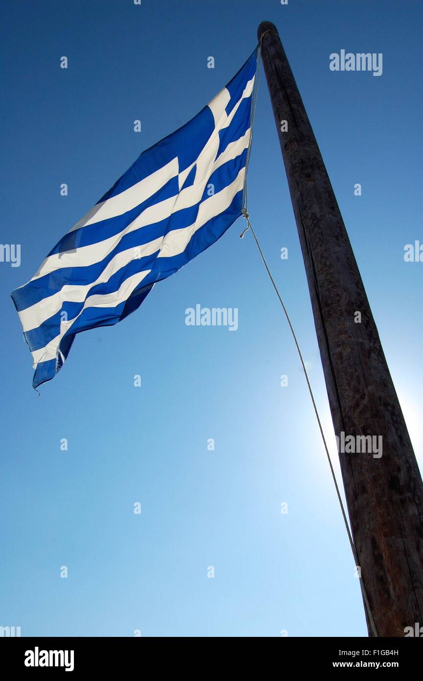 Greek flag flying against a clear blue sky Stock Photo - Alamy