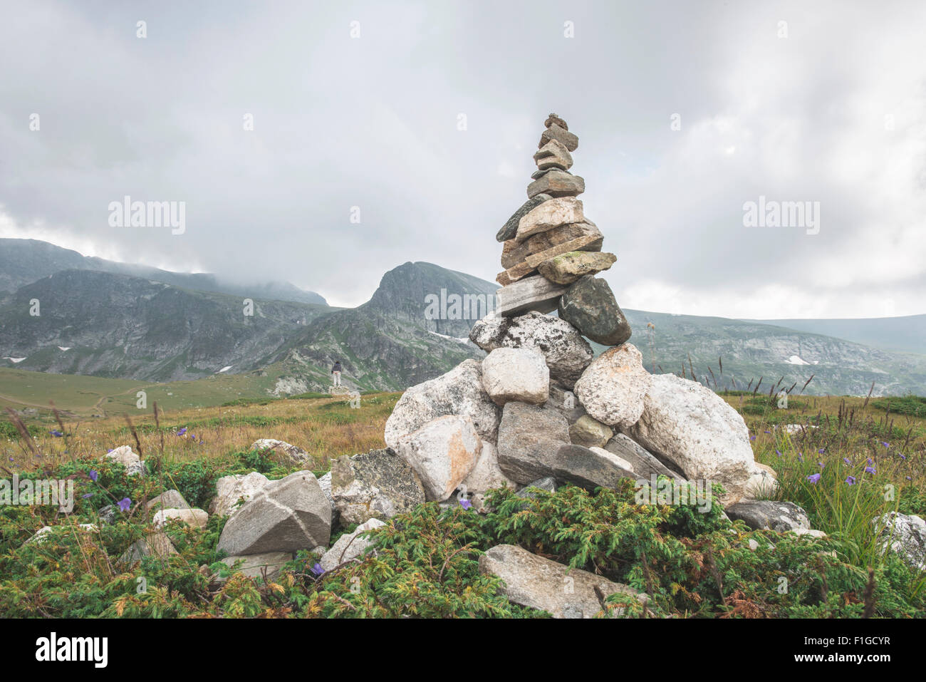 Stacked stones in the mountain. Dramatic sky Stock Photo - Alamy