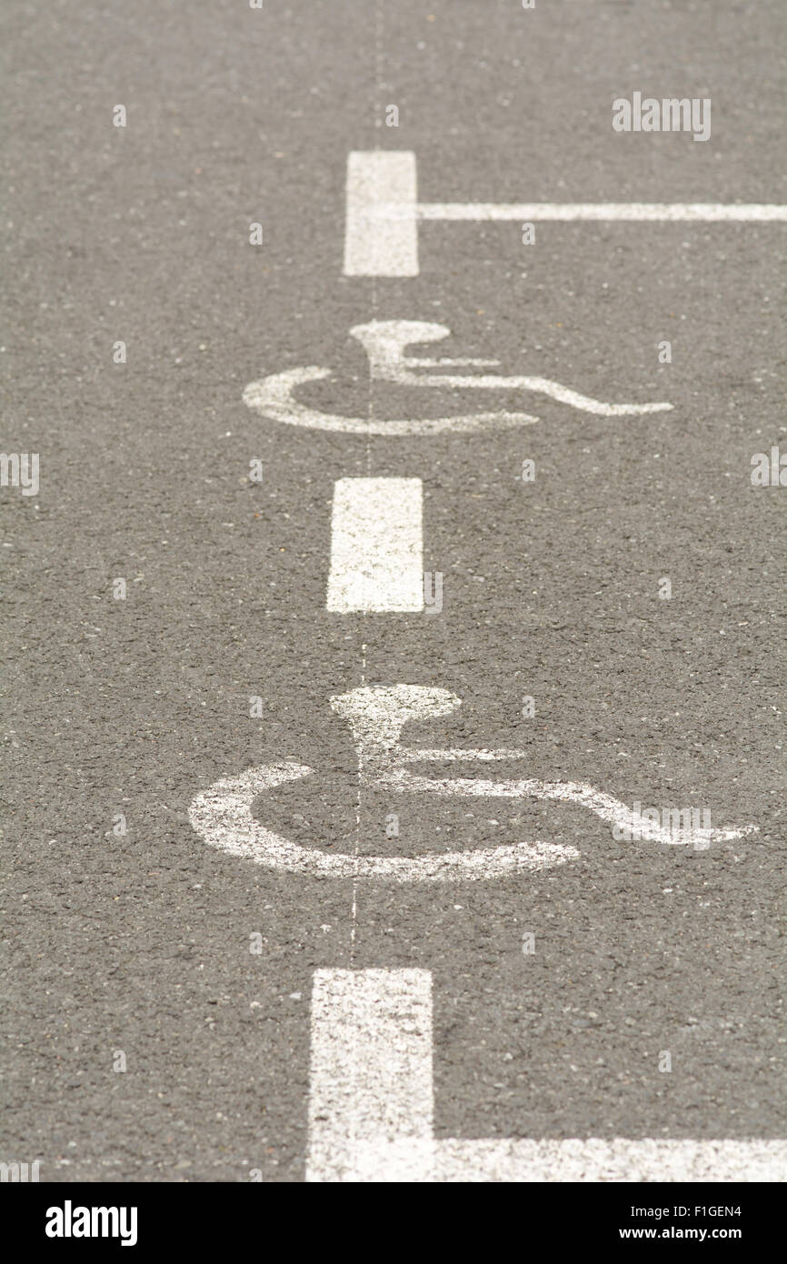 Disabled person parking bay - with wheelchair symbol in car park in ...