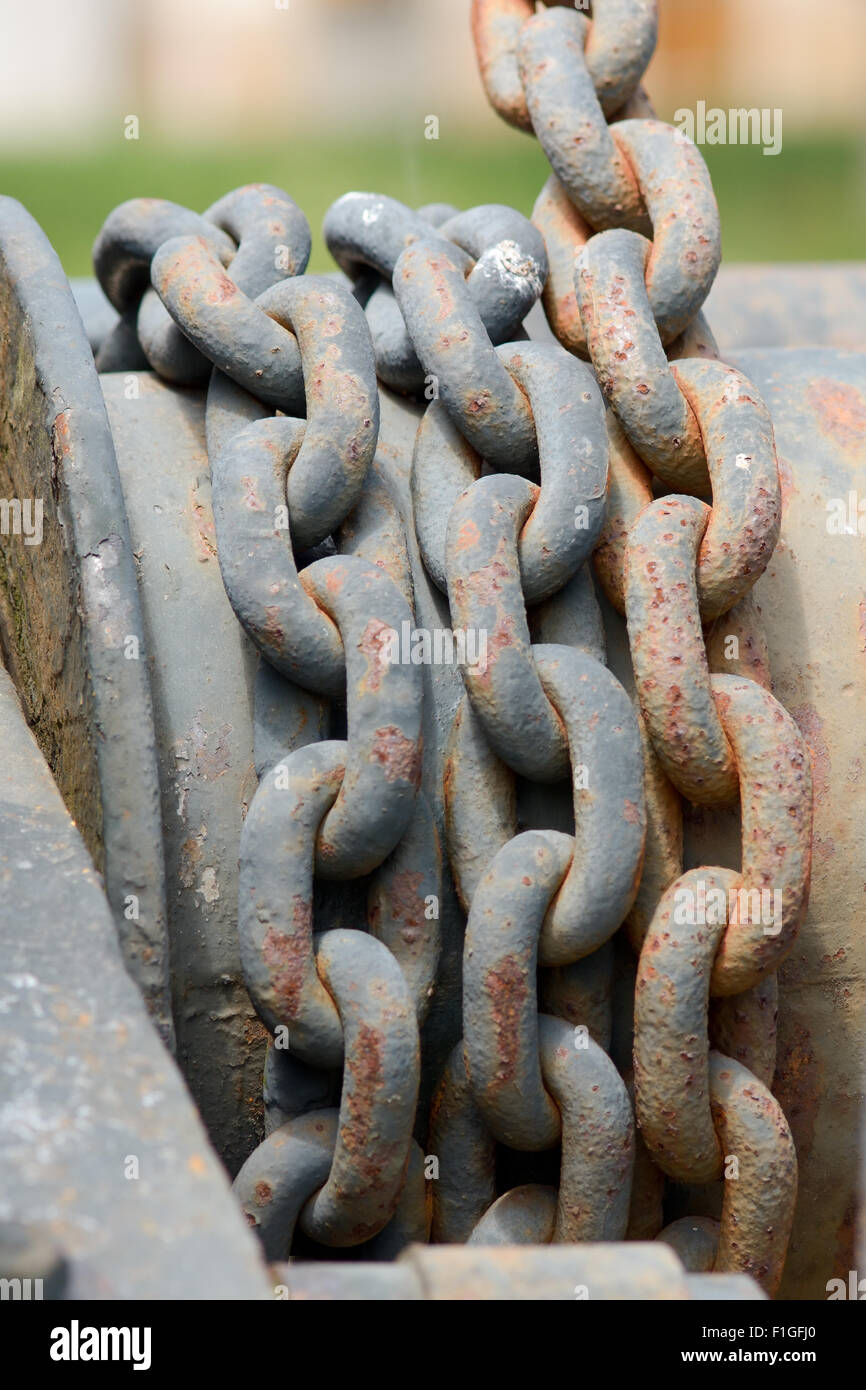 Metal chain on crane used to help lift heavy objects via pulley and ...