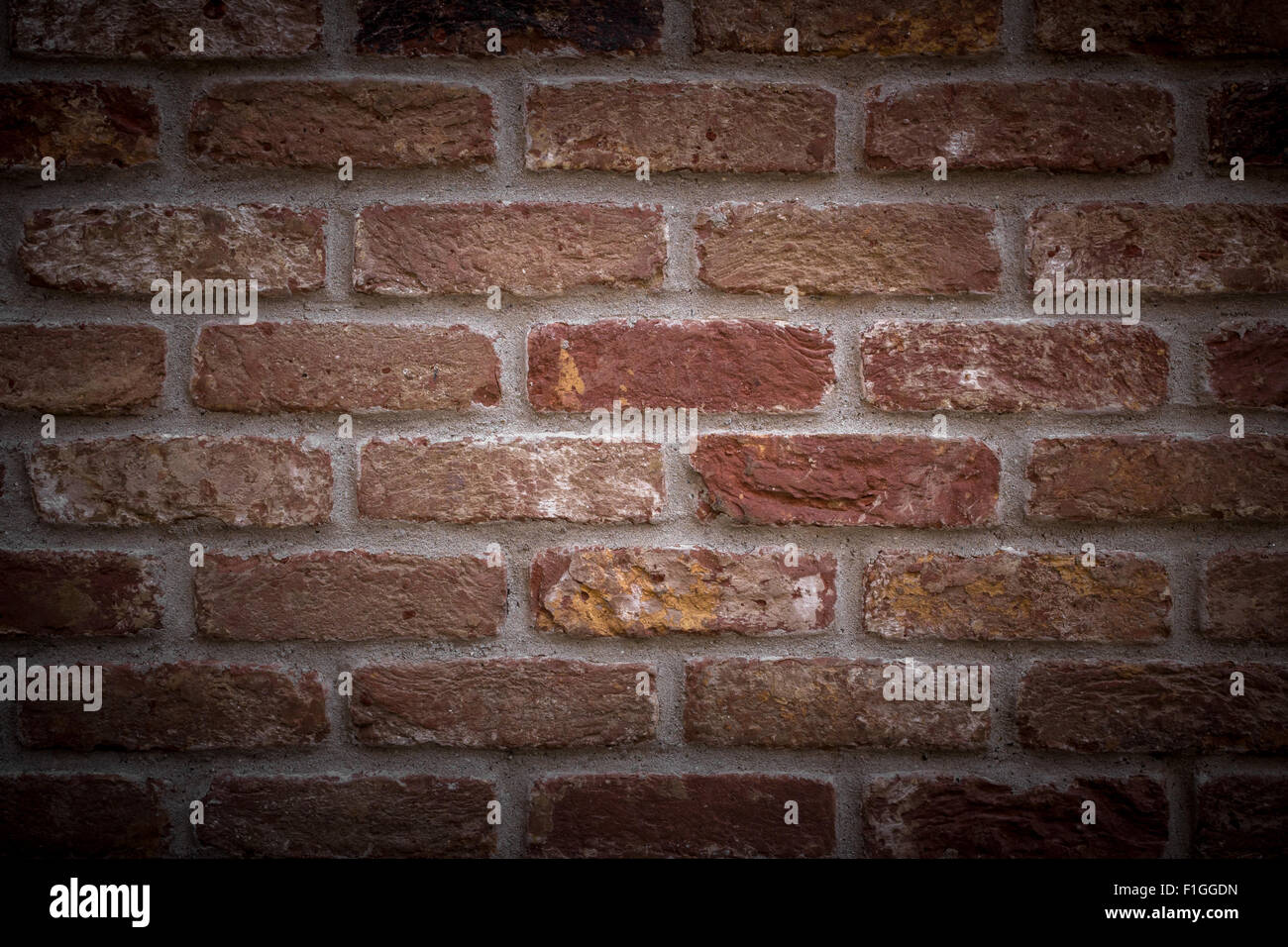 Front view of a red brick wall and brown, by irregular sizes Stock ...