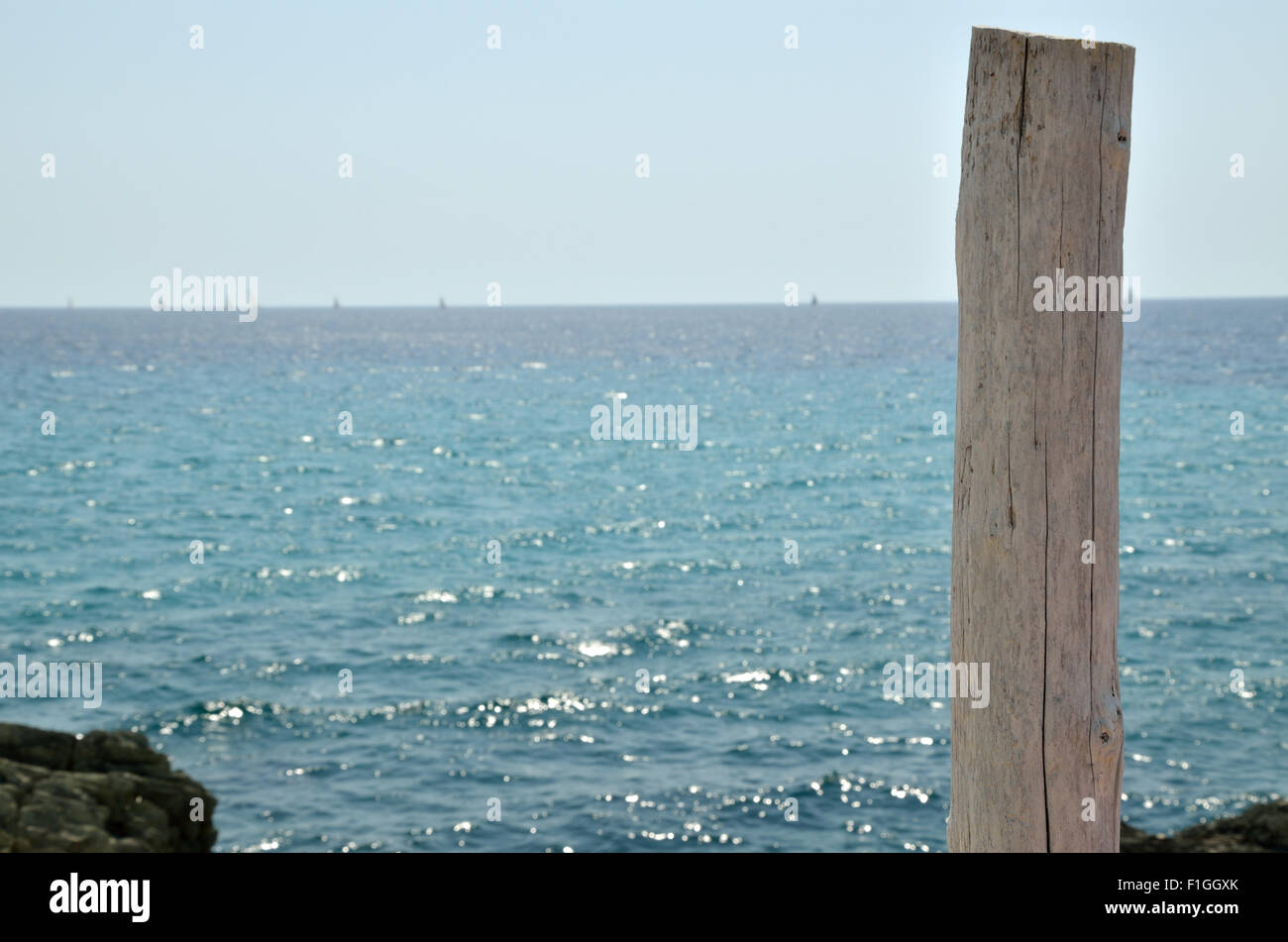 White wooden column over sea and silhouettes of sailing boats Stock ...