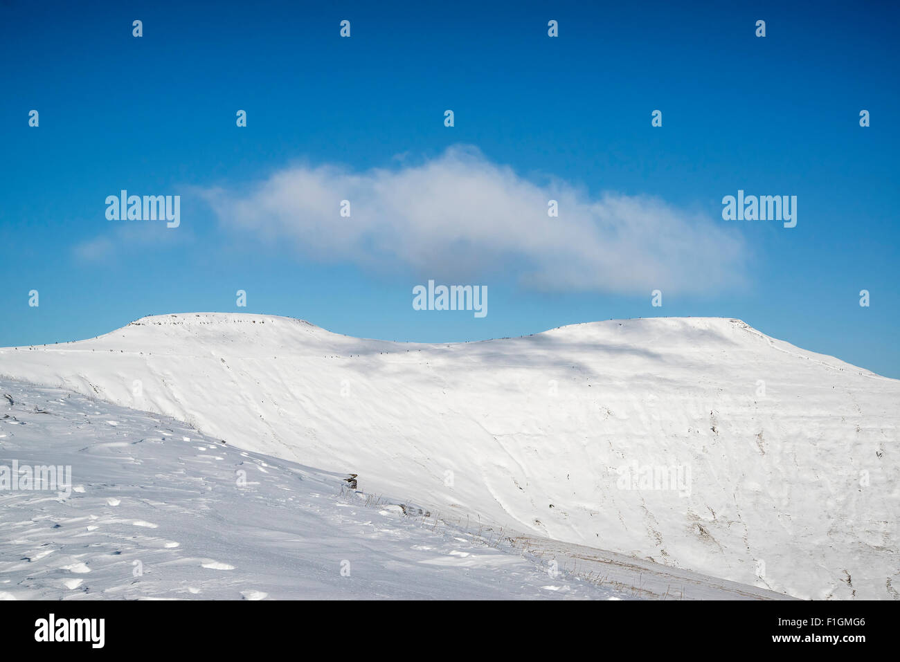Stunning blue sky mountain landscape in Winter with snow covered slopes ...