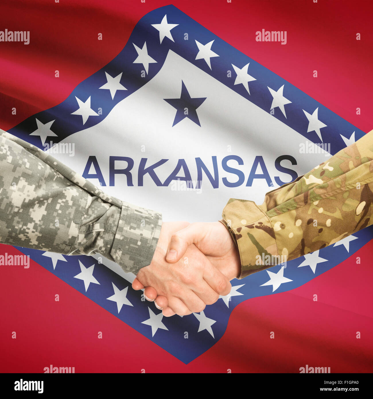Soldiers handshake and US state flag - Arkansas Stock Photo - Alamy