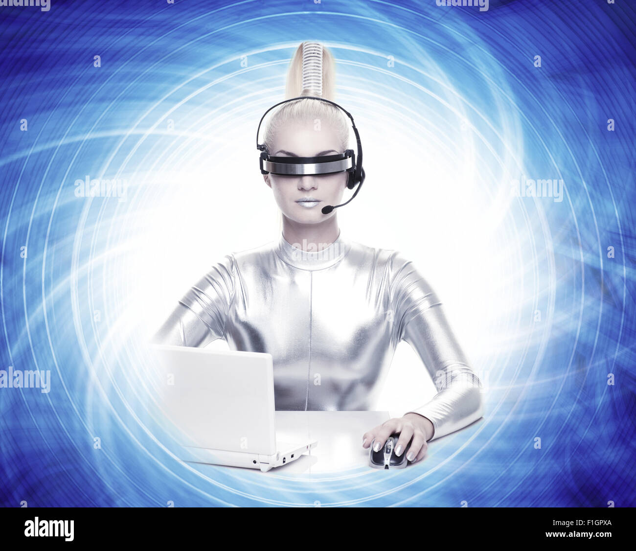 Beautiful cyber woman working on her laptop Stock Photo - Alamy