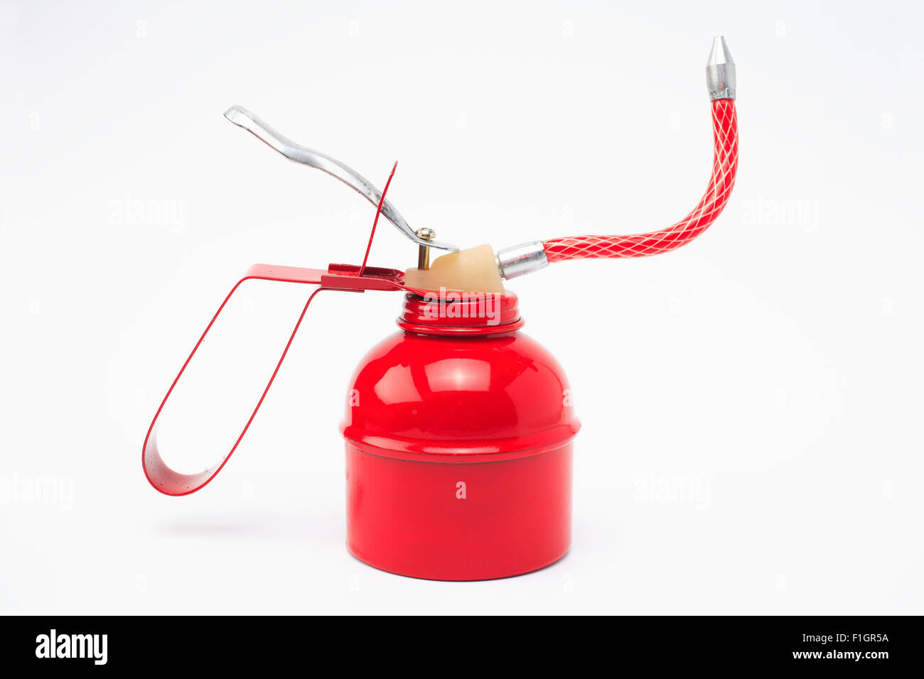Red oilcan with adaptable oil valve as a free plate Stock Photo - Alamy
