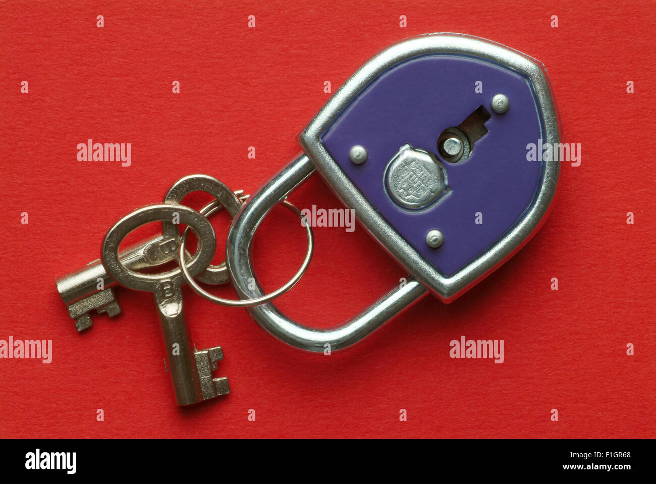 Blue lock me to two keys Stock Photo - Alamy