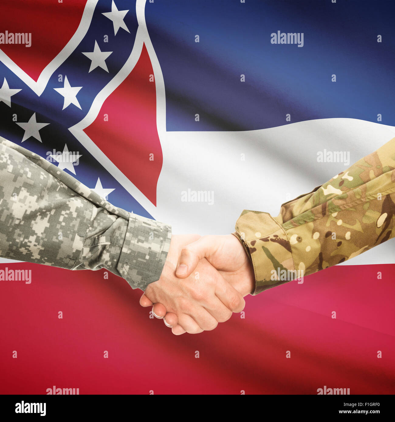 Soldiers handshake and US state flag - Mississippi Stock Photo - Alamy