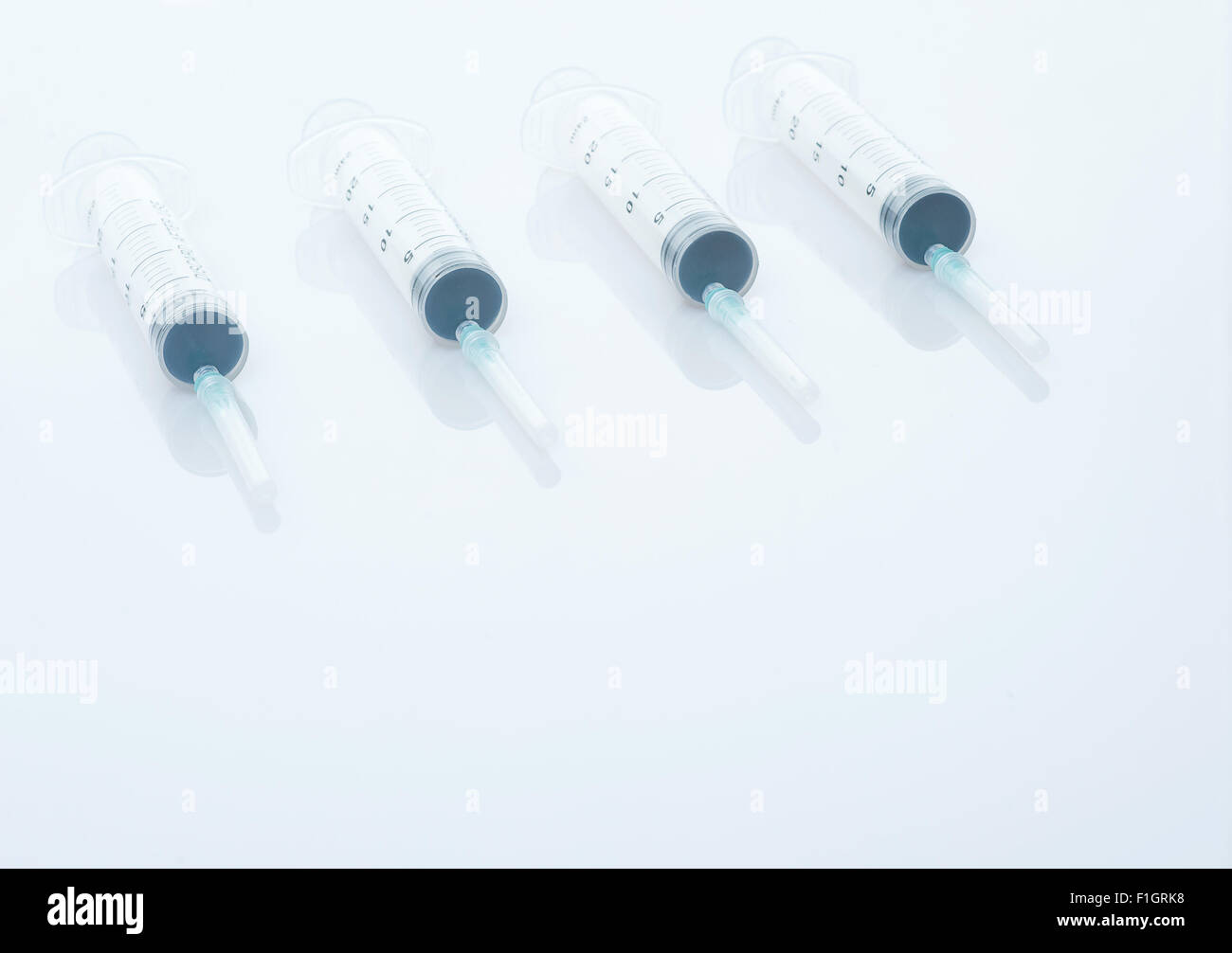 Syringe isolated on white background Stock Photo - Alamy