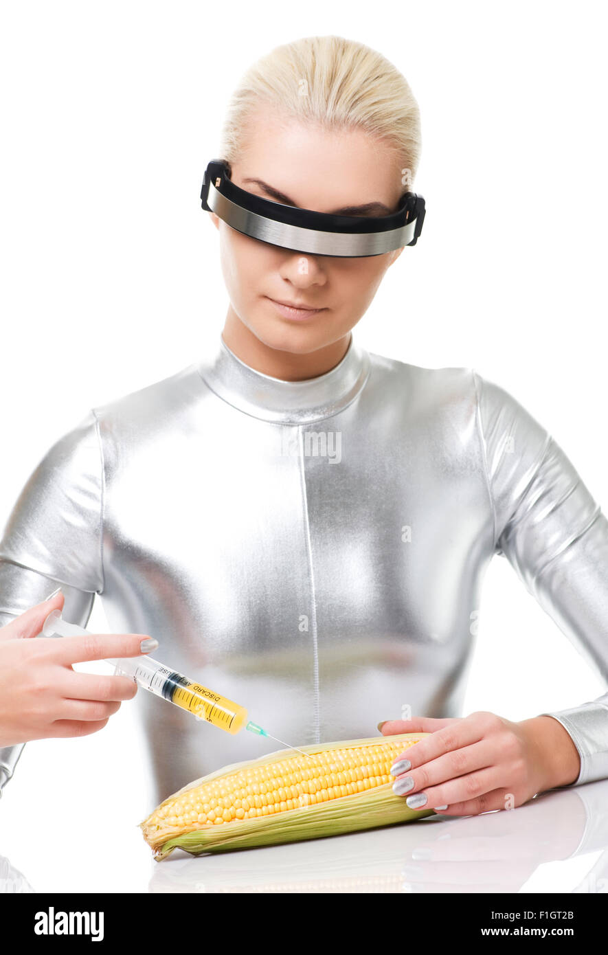 Cyber woman taking a vitamins from corn Stock Photo - Alamy