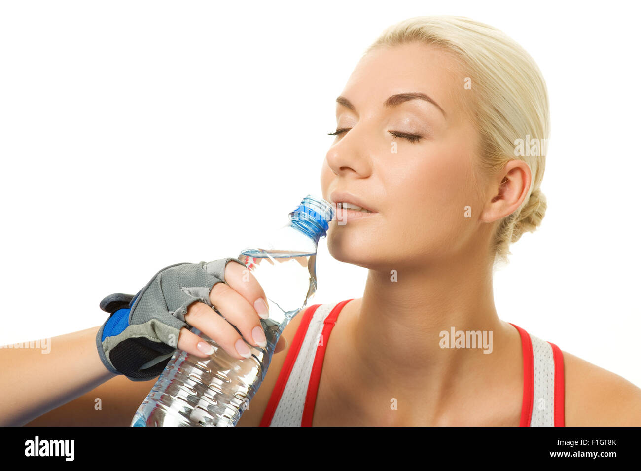 Fitness trainer drinking water Stock Photo - Alamy