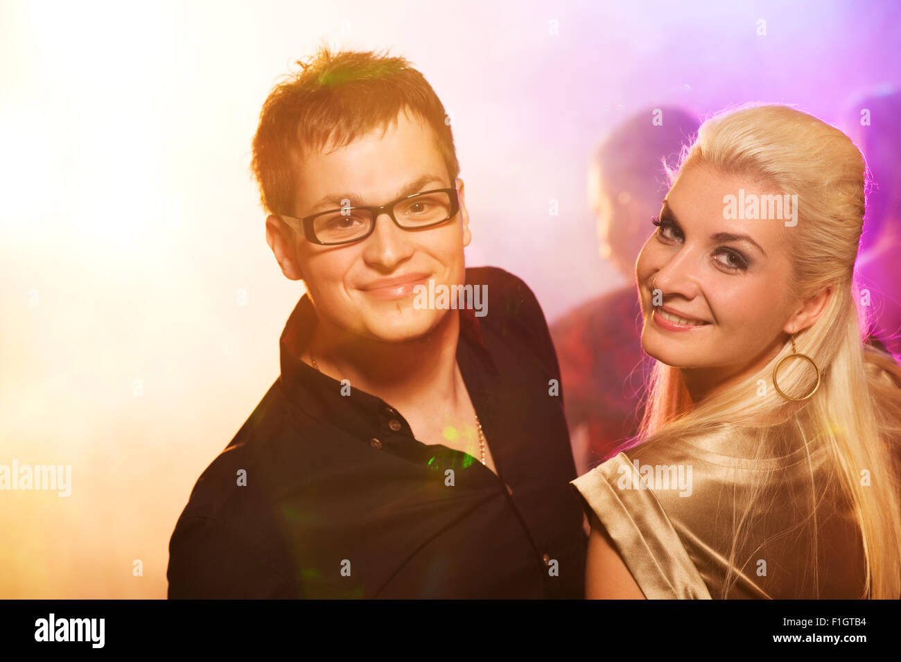 Happy couple in the night club Stock Photo - Alamy