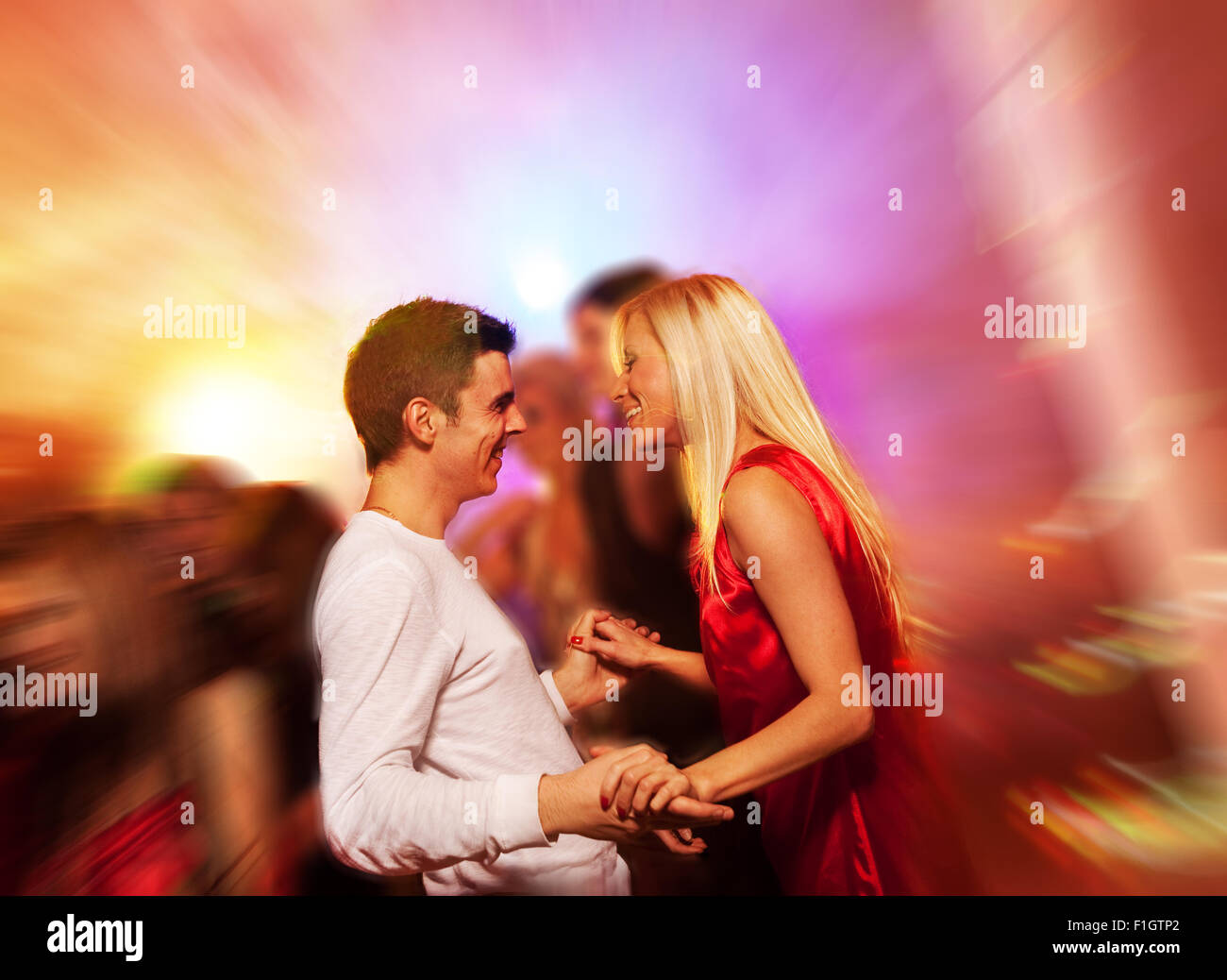 Happy couple in the night club Stock Photo - Alamy