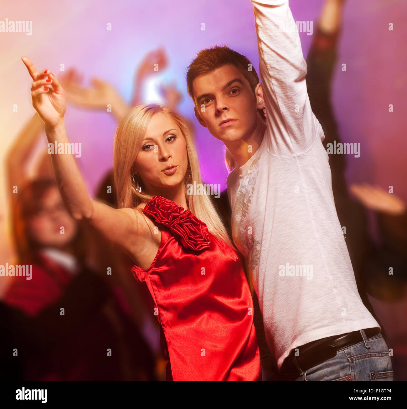 Happy couple in the night club Stock Photo - Alamy