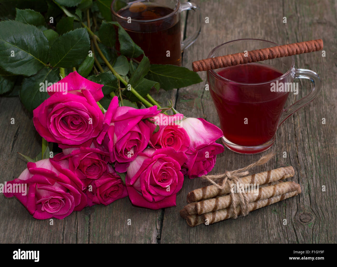 red roses and two glasses of tea Stock Photo - Alamy