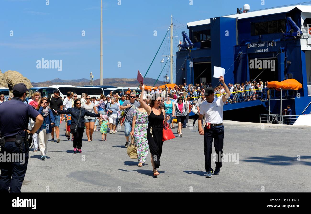 Ferry passengers arriving in the port of Ormos Athinios Santorini ...