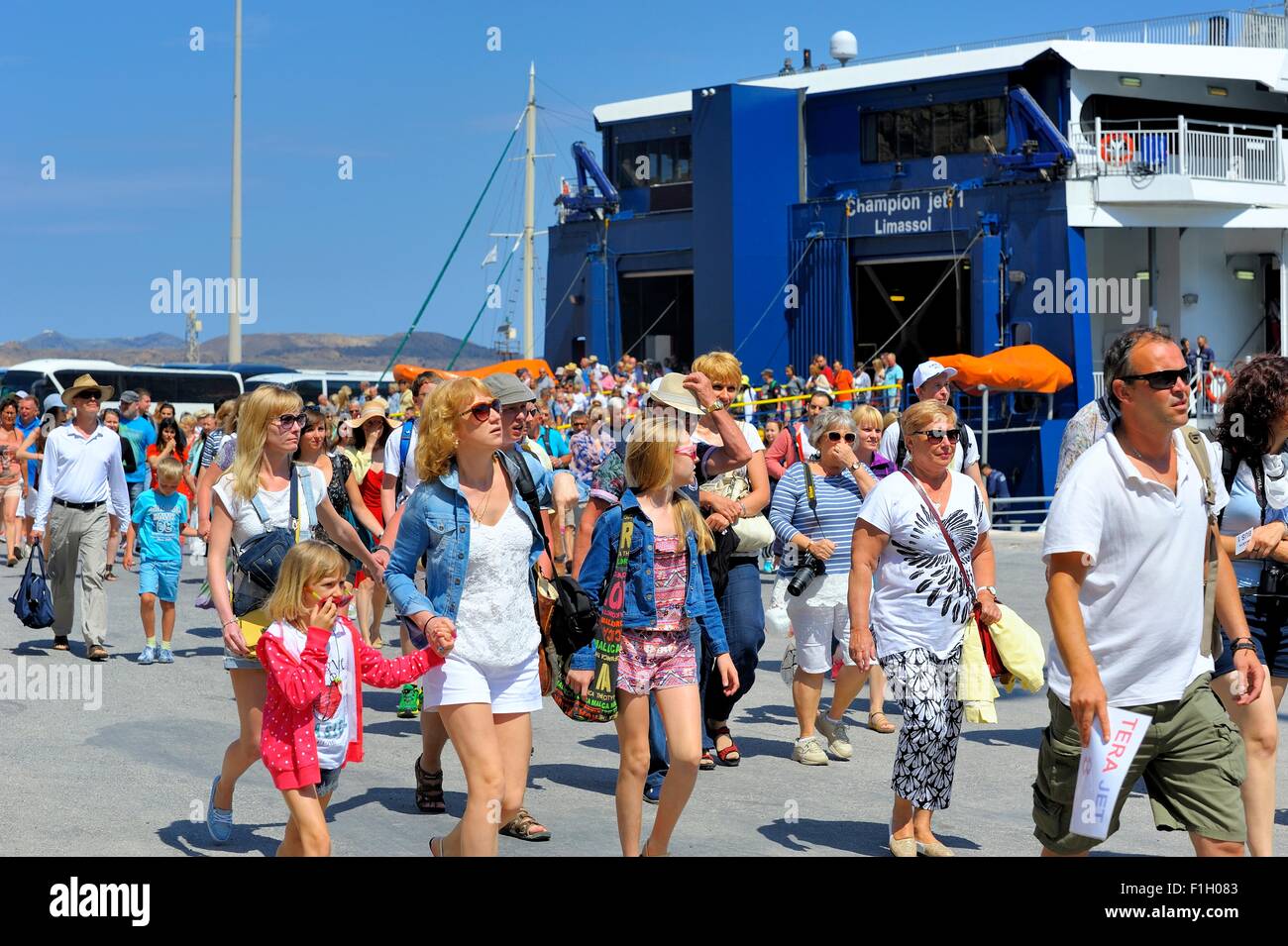 Ferry passengers arriving in the port of Ormos Athinios Santorini ...