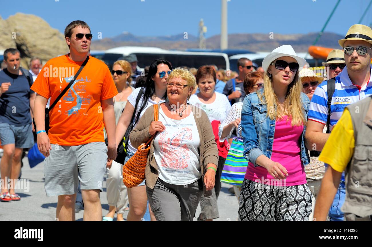 Ferry passengers arriving in the port of Ormos Athinios Santorini ...
