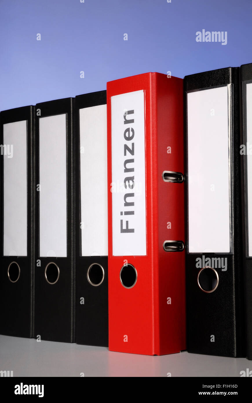 Red file folder labeled Finance Stock Photo - Alamy