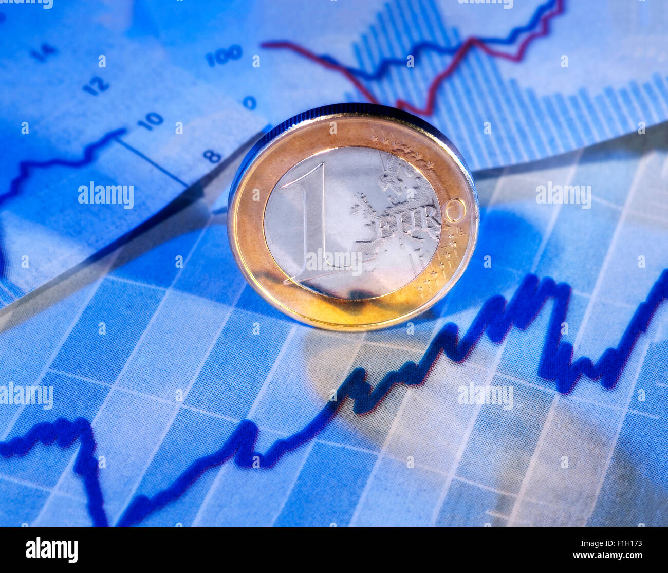 Euro coin and graph with rising curve Stock Photo - Alamy