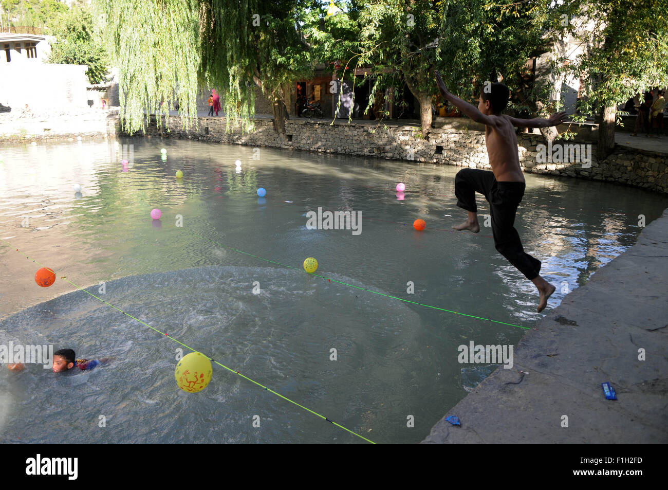 Boy jumps into pond hi-res stock photography and images - Alamy