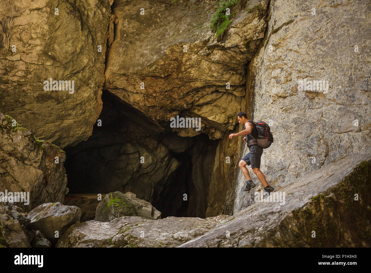 Caucasian man hiker walking into a cave Stock Photo - Alamy Caucasian man hiker walking into a cave Stock Photo - Alamy