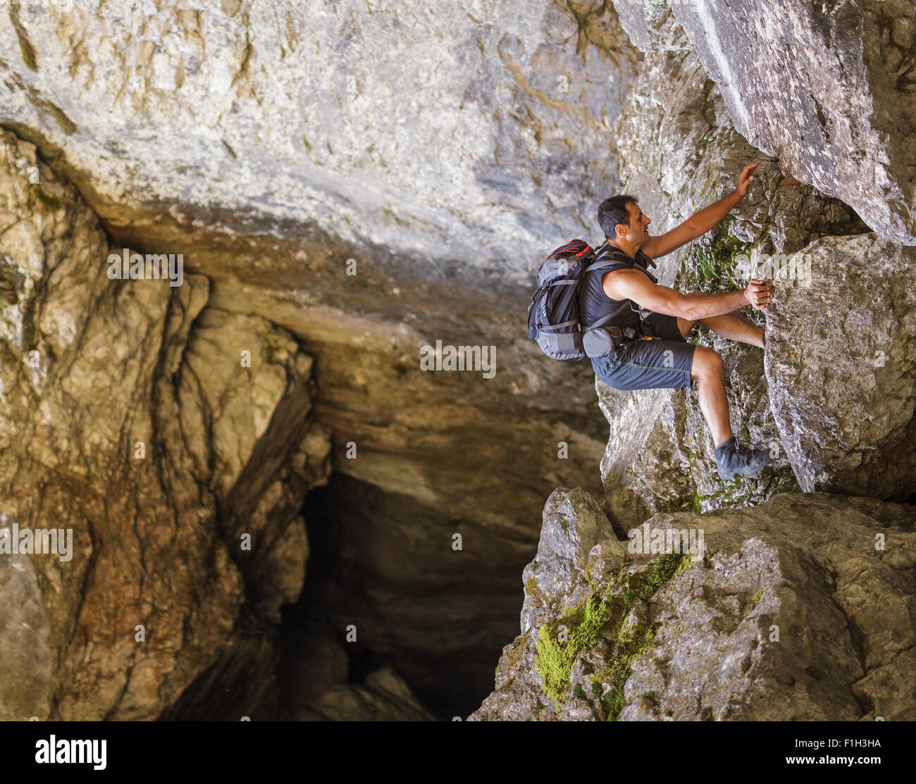 Man climbing over wall hi-res stock photography and images - Alamy