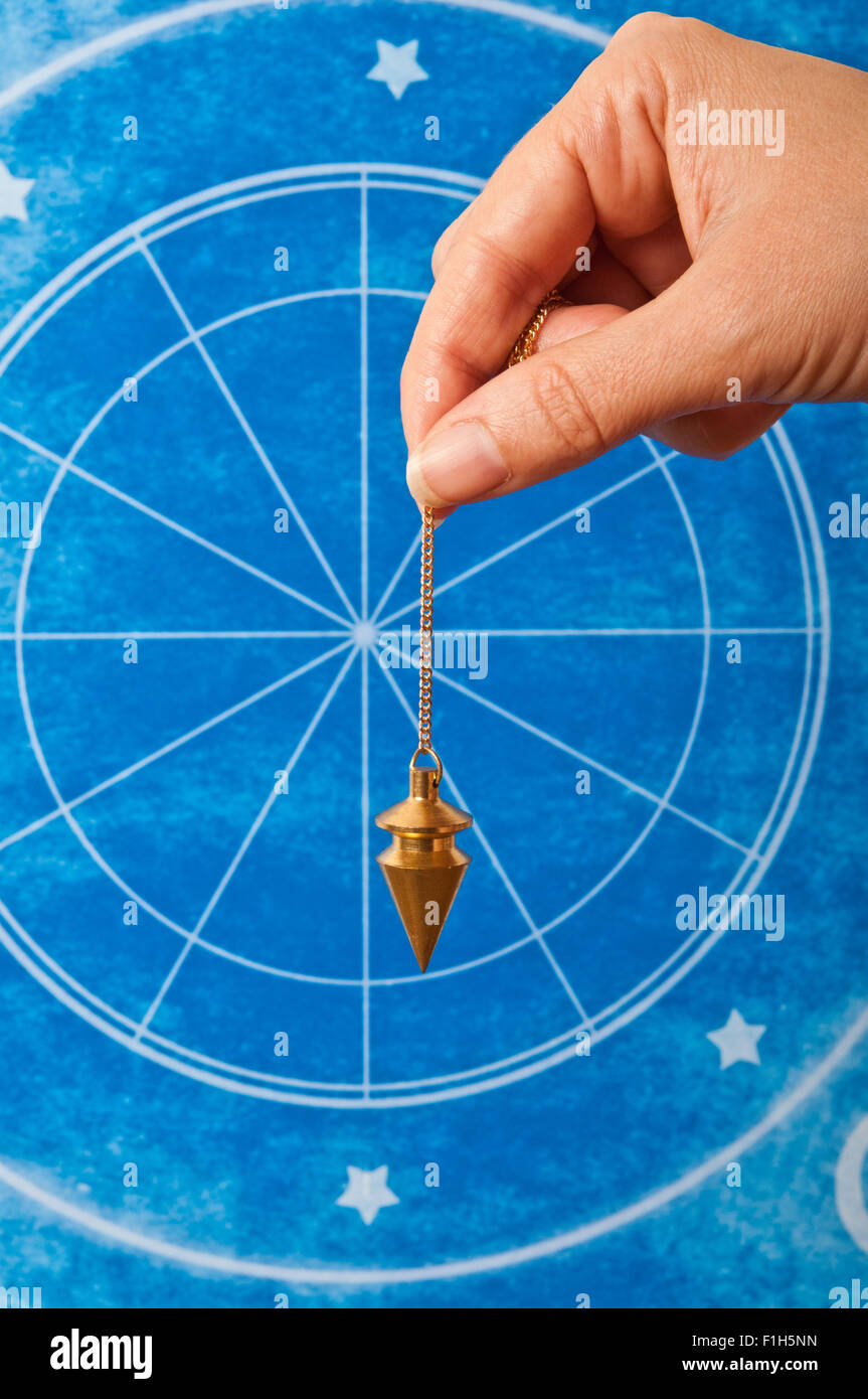astrology and pendulum Stock Photo - Alamy