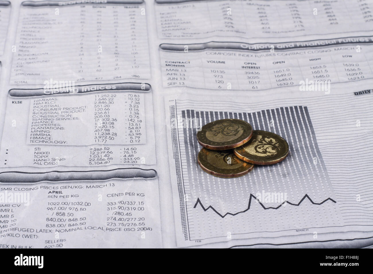 coins with newspaper with close-up position Stock Photo - Alamy