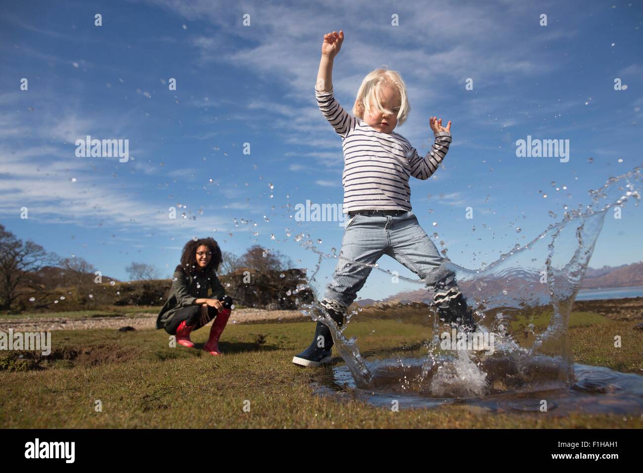 Splashing in puddle hi-res stock photography and images - Alamy