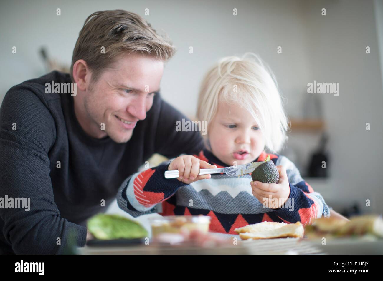 Father andf son preparing food Stock Photo - Alamy