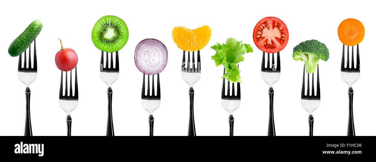 Fruits and vegetables on the forks. Healthy food Stock Photo - Alamy