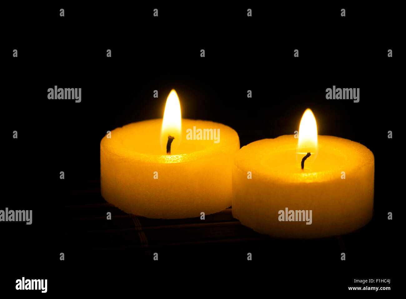 Two candles in the dark Stock Photo - Alamy