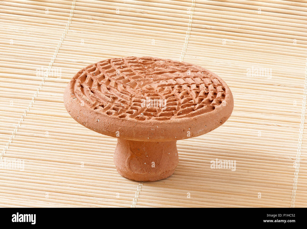 Clay foot exfoliator pumice stone Stock Photo - Alamy