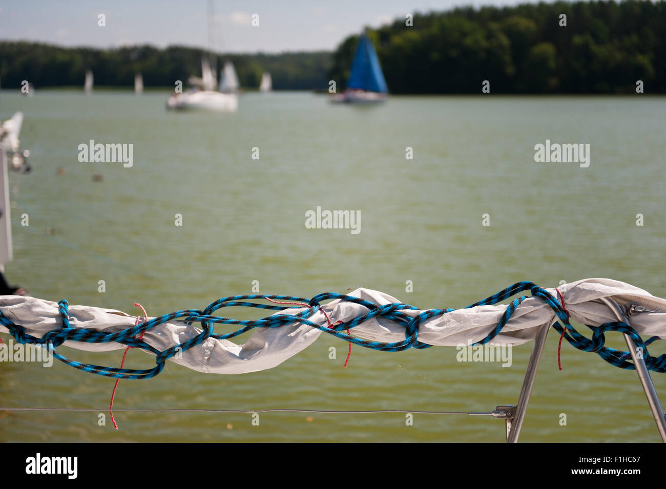 Rolled up mast sail material at Masuria Stock Photo - Alamy