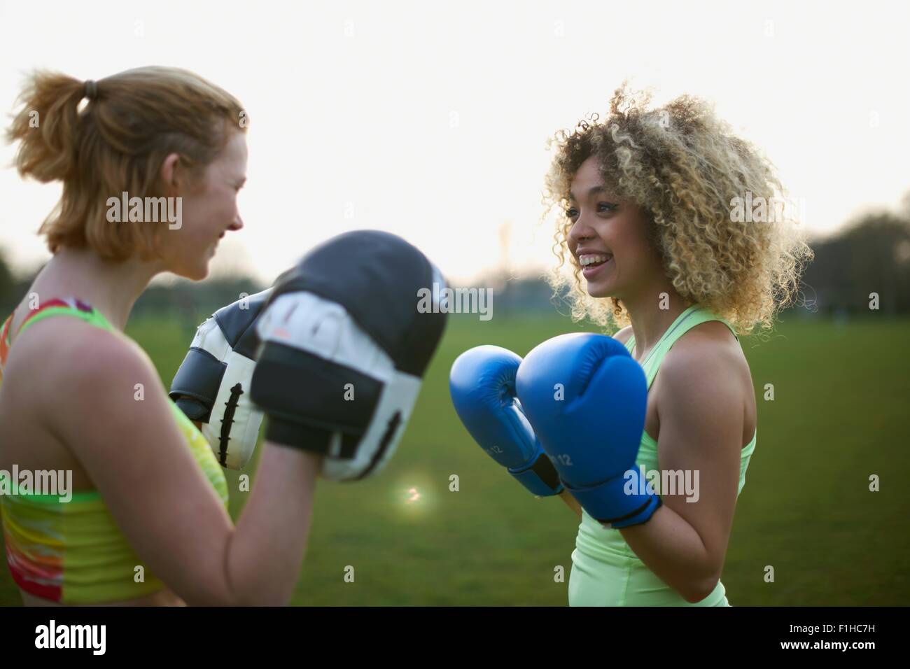 Two women boxing gloves hi-res stock photography and images - Alamy