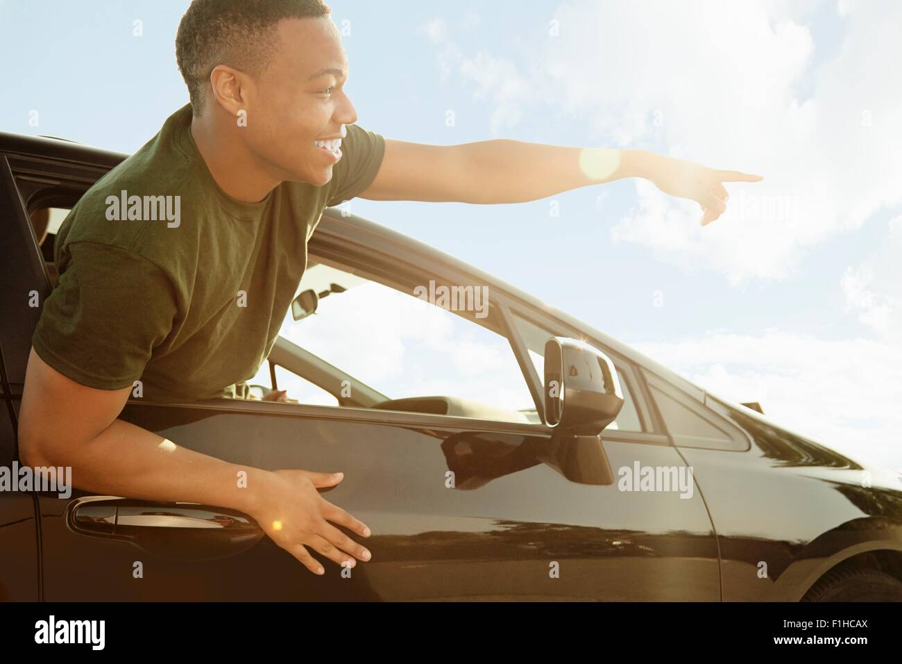 Man leaning out of car window hi-res stock photography and images - Alamy