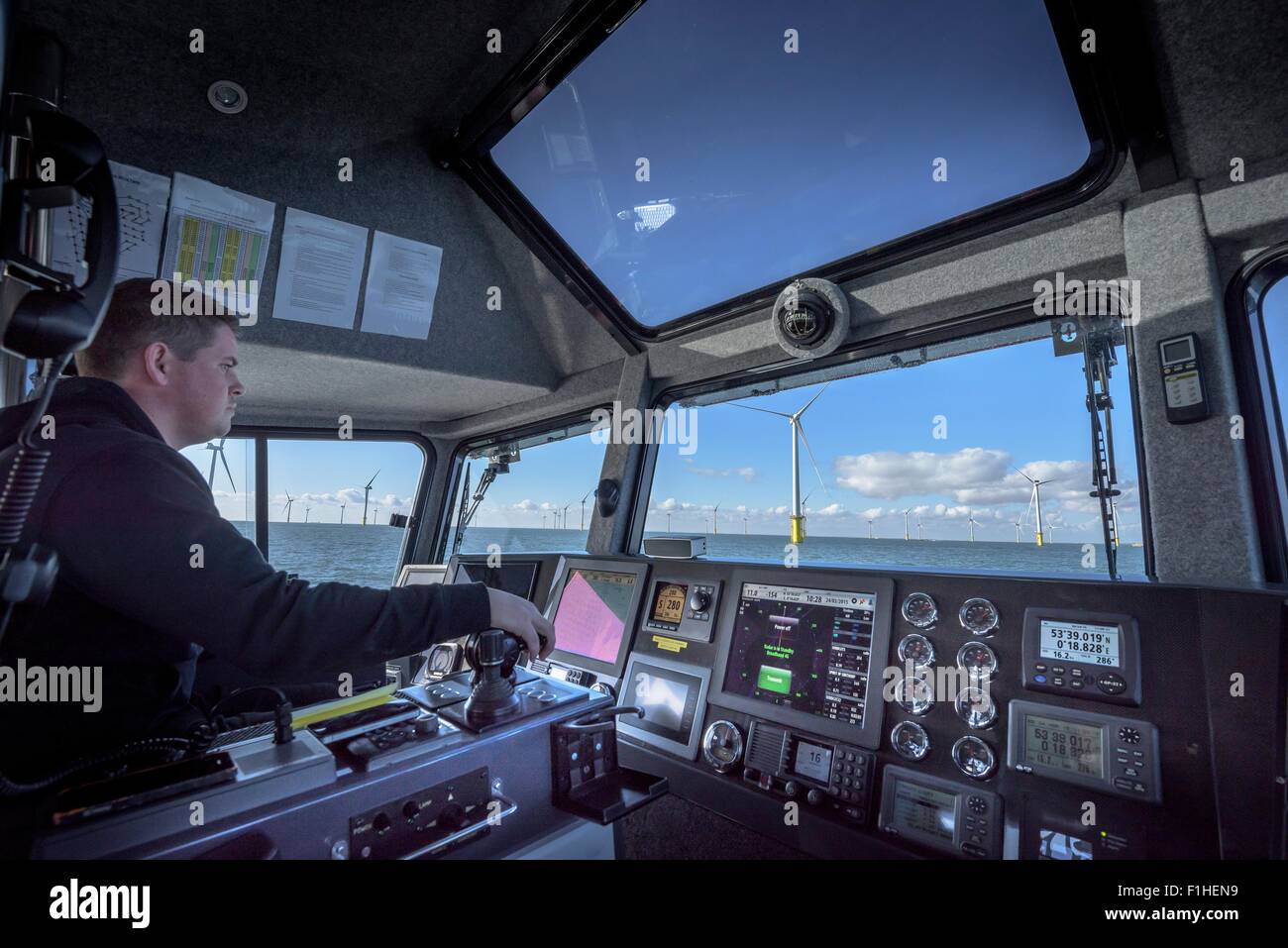 Man steering boat hi-res stock photography and images - Alamy