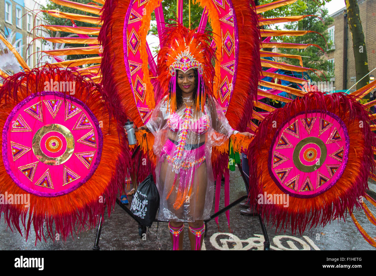 London, August 31st 2015. Revellers ignore the inclement weather to ...