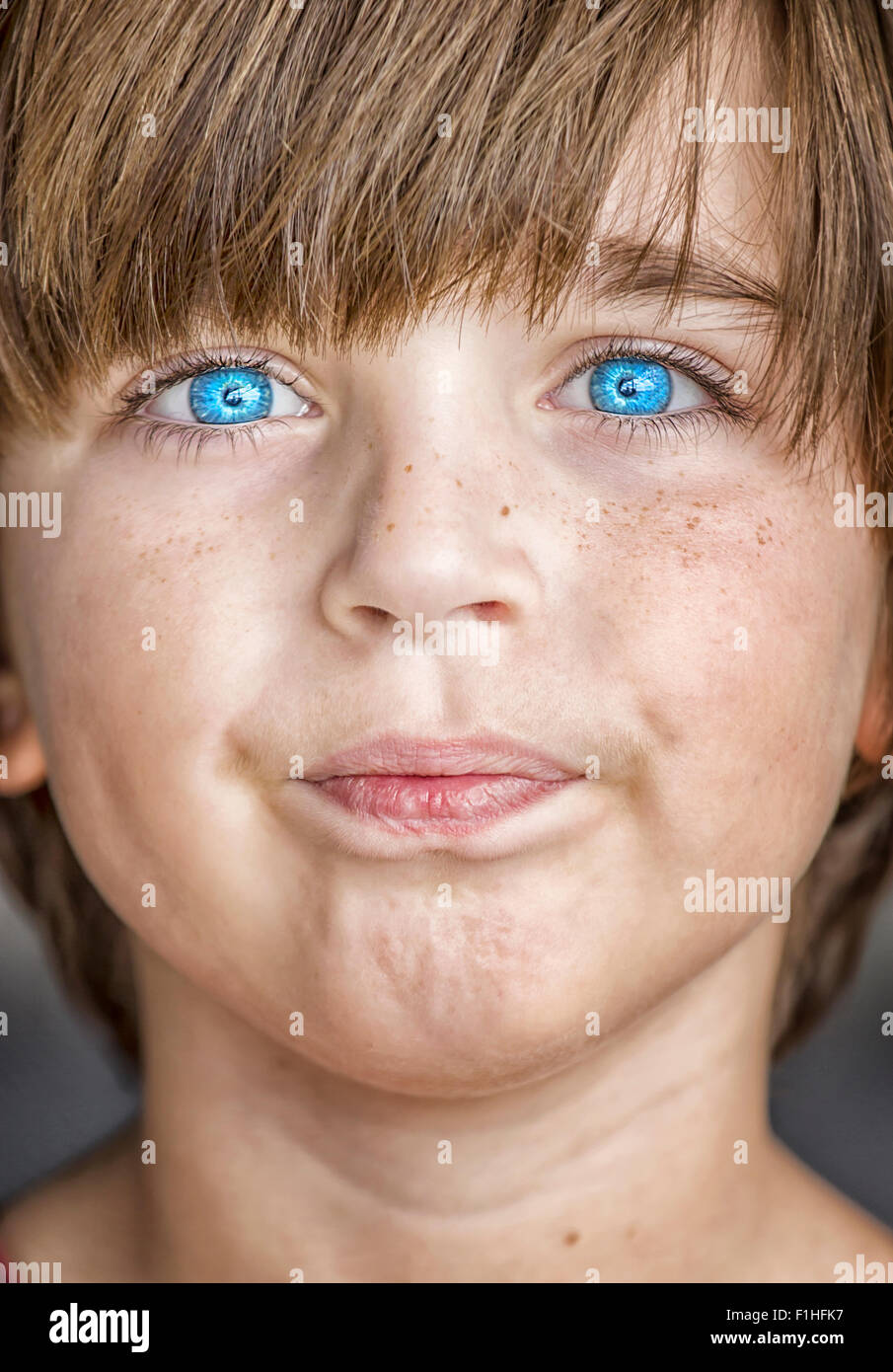 insightful look blue eyes boy Stock Photo - Alamy