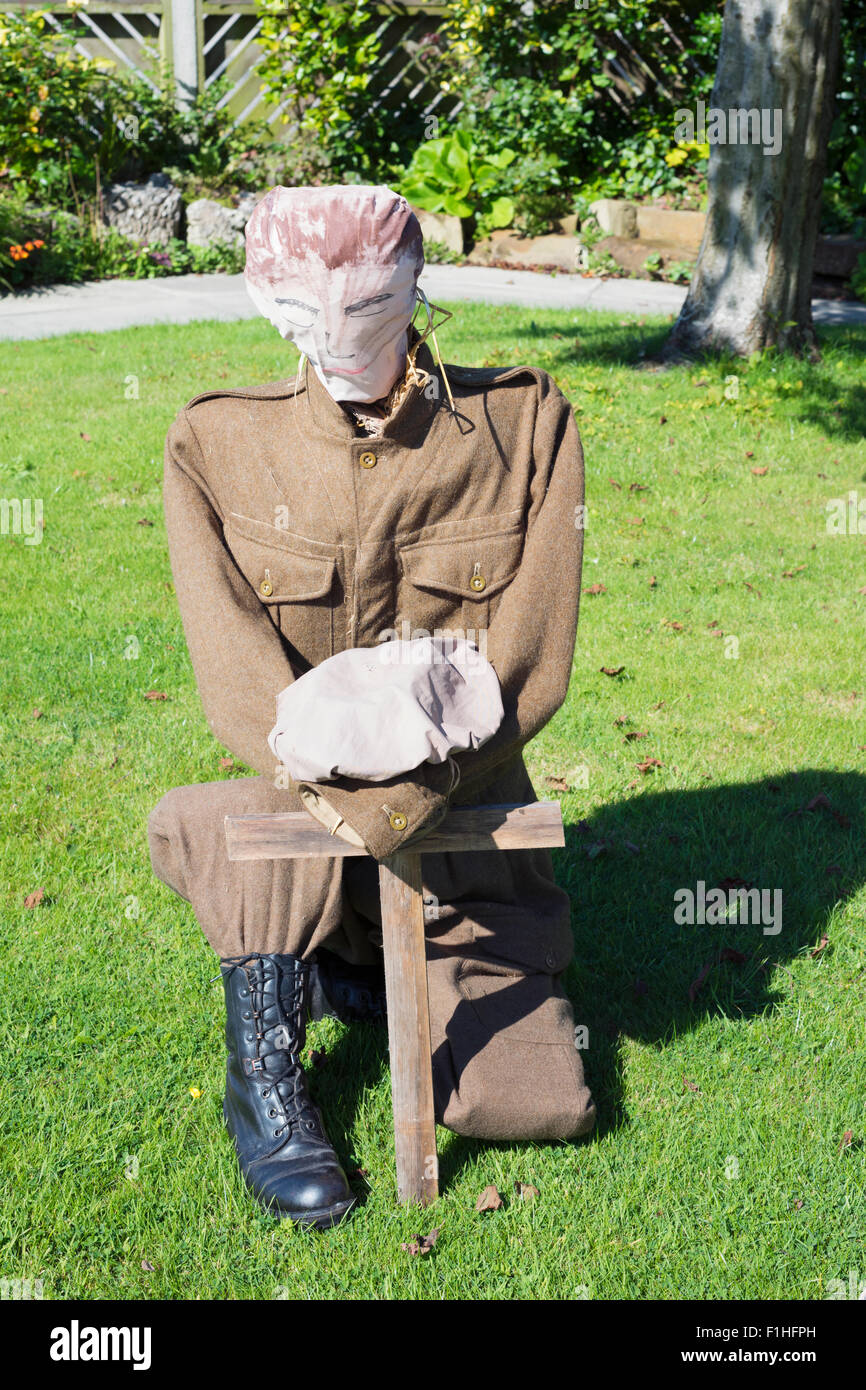 A scarecrow soldier pays his respects at the village war memorial ...